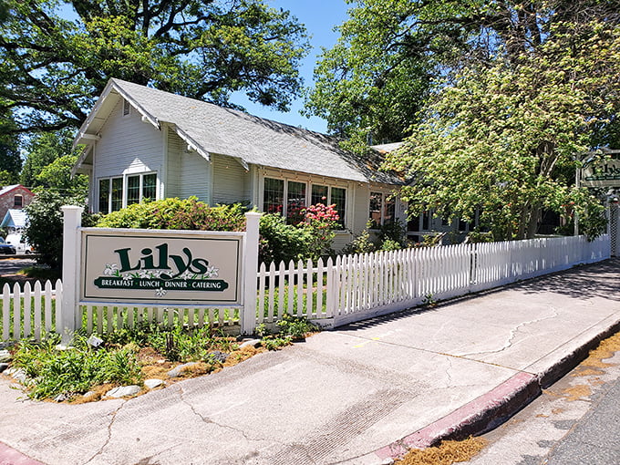 Lily's Restaurant, where the white picket fence promises comfort food that grandma would approve of—if grandma were a gourmet chef.