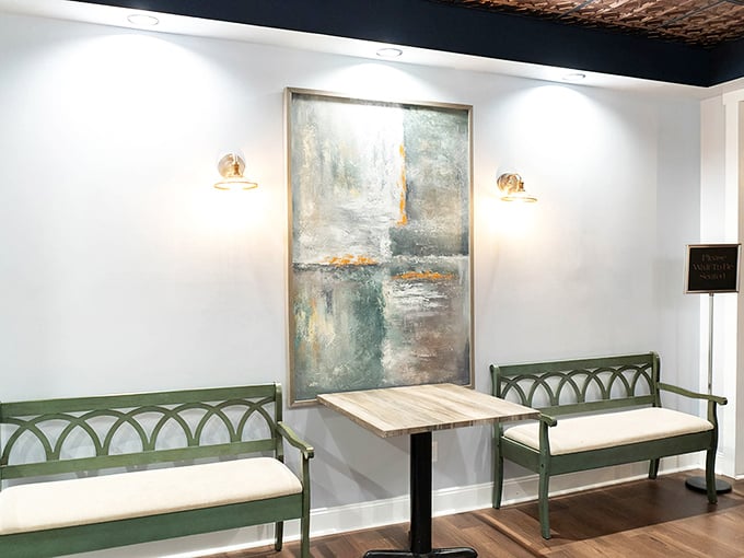 These elegant green benches in the waiting area suggest you're about to experience something special—not just another fish fry.