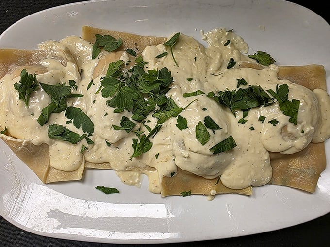 Lobster ravioli draped in cream sauce and fresh herbs – pasta pillows stuffed with ocean treasure. Fork-twirling has never been so rewarding.