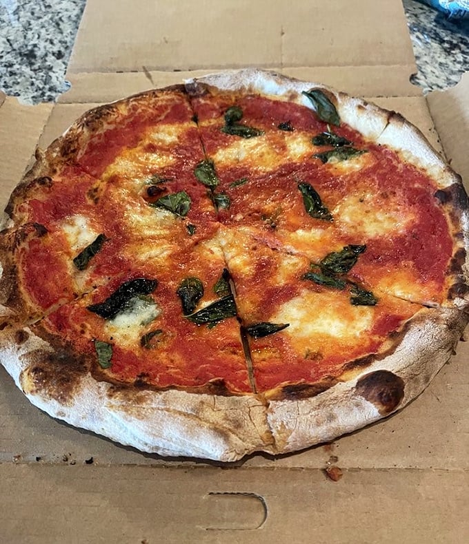 The Margherita—pizza's equivalent of the little black dress—simple, classic, and always the right choice.