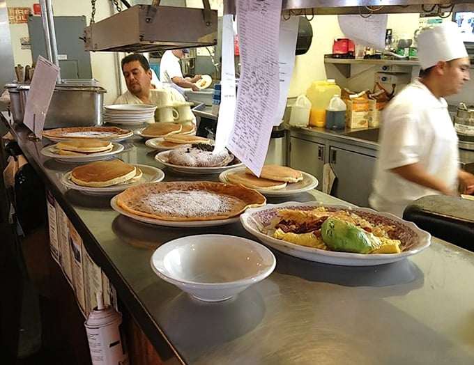 Where the magic happens – pancakes lined up like golden discs of joy, awaiting their moment of glory on your plate.