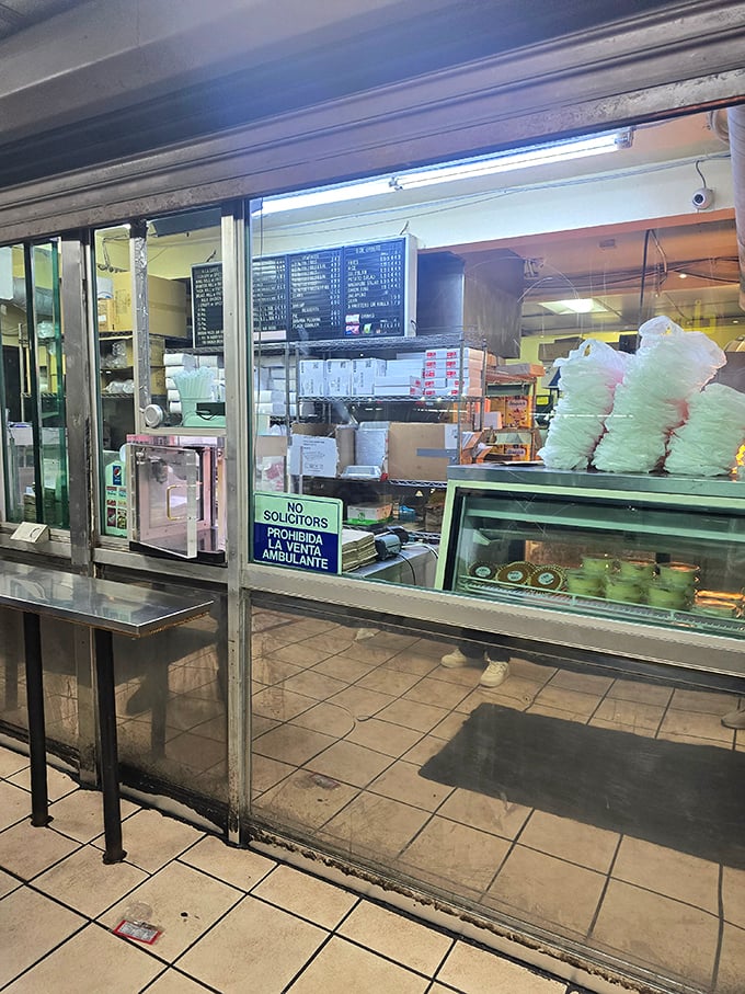 The ordering window—a portal to pleasure where dreams of crispy chicken and sides become delicious reality.