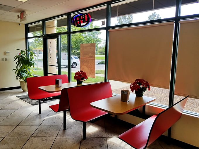 Bright red seating and natural light create the perfect stage for your donut experience. Like a theater where the audience gets to eat the performers.