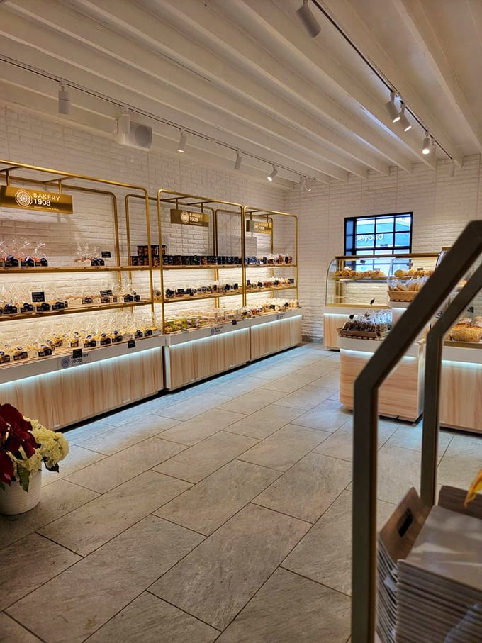 Gold accents and white brick create a backdrop that makes every pastry look like it's auditioning for a food magazine cover shoot.