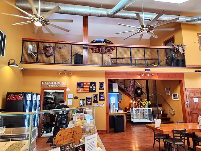 The loft space and industrial touches blend surprisingly well with the warm yellow walls—like how a touch of vinegar brightens up a rich barbecue sauce.