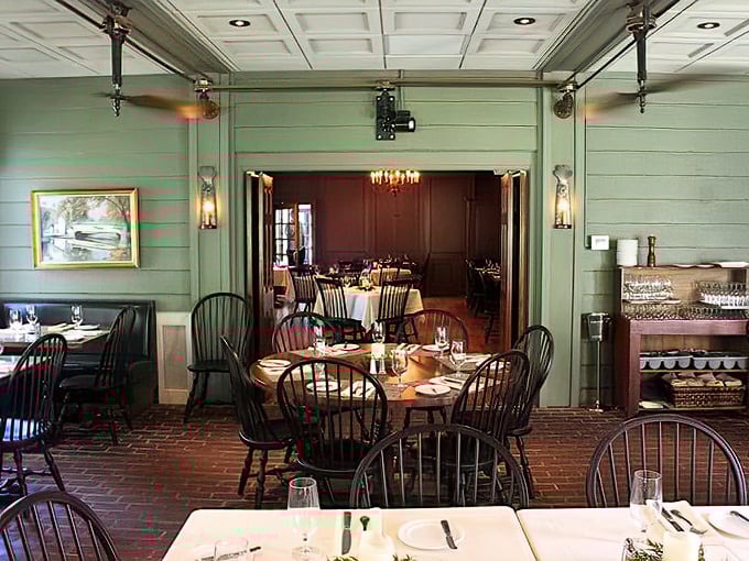 Elegant simplicity in the dining room where Windsor chairs and wooden tables set the stage for memorable meals.