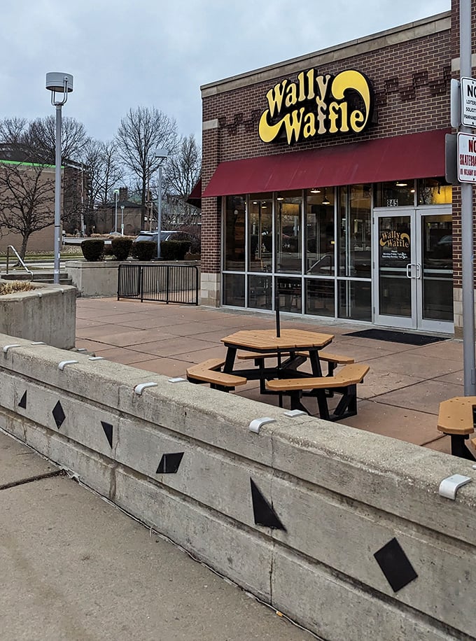 Even on a gray Ohio day, that yellow sign promises warmth inside—both from the friendly service and the hot waffles.