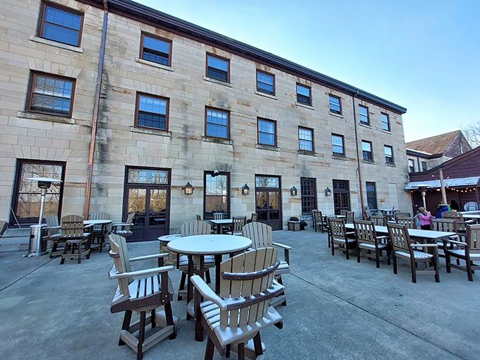 The Spring Mill Inn's limestone façade and inviting patio furniture promise rest and relaxation after a day of historical adventuring.