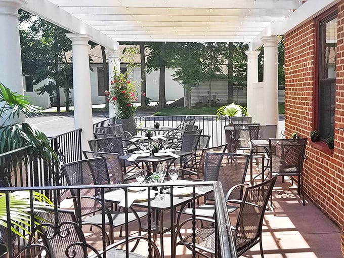 The covered porch offers al fresco dining with Pennsylvania charm—summer evenings were invented for exactly this kind of experience.