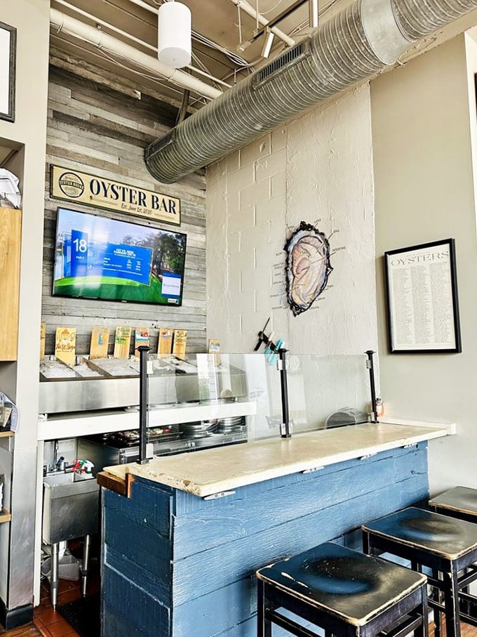 The oyster bar—where briny treasures await the adventurous palate in a setting that honors the craft of shucking.