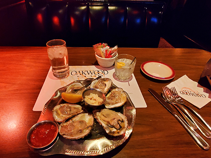Oysters on a silver platter—nature's perfect appetizer with just the right accessories. Ocean treasures that traveled far to meet your lemon wedge.
