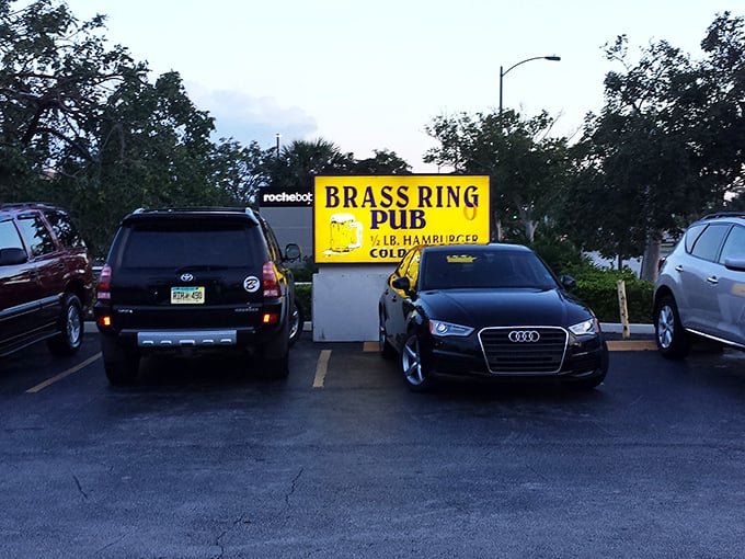 The parking lot where cars from all price points gather in democratic harmony, united by the universal language of great burgers.