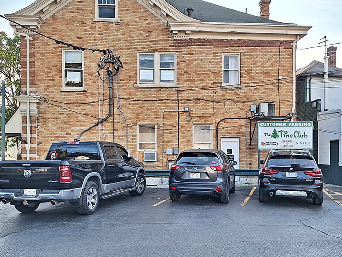 The unassuming parking area behind The Pine Club – where countless diners have arrived hungry and departed in a state of blissful satisfaction.