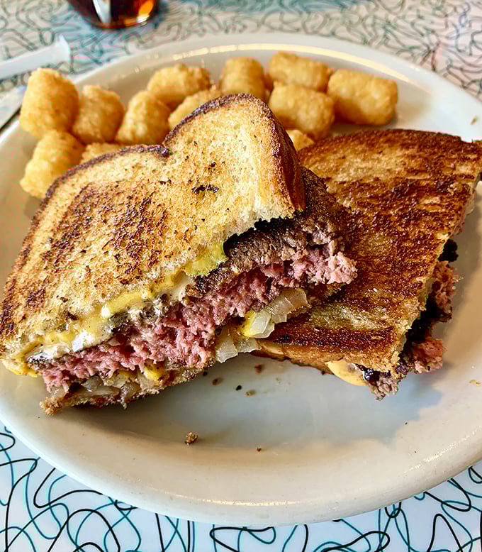 The patty melt—diner royalty that never disappoints. Perfectly grilled bread revealing a glimpse of the beefy, oniony, cheesy paradise within.