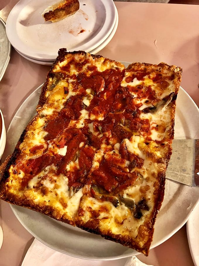 Pepperoni that curls into perfect little cups, collecting flavor pools that make you wonder if you've been eating pizza wrong your entire life.