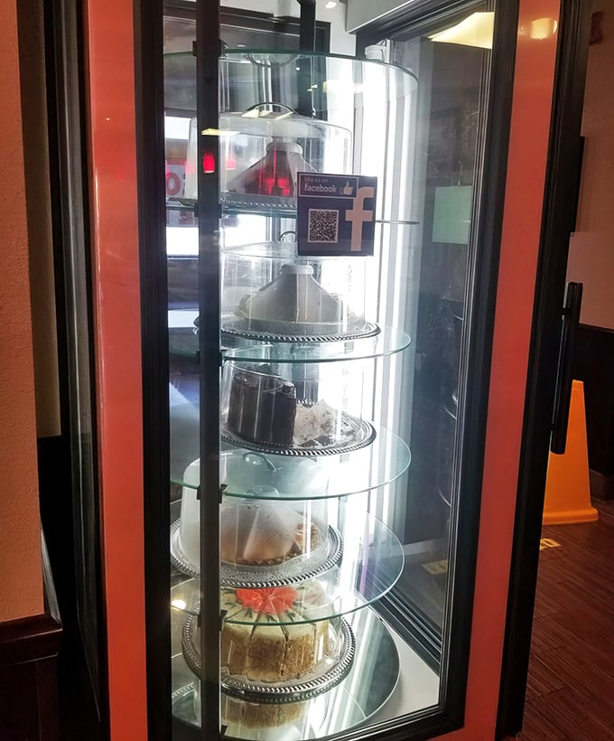 The dessert case – a glass-enclosed museum of temptation where willpower goes to die and "I'll just have a bite" becomes a beautiful lie.