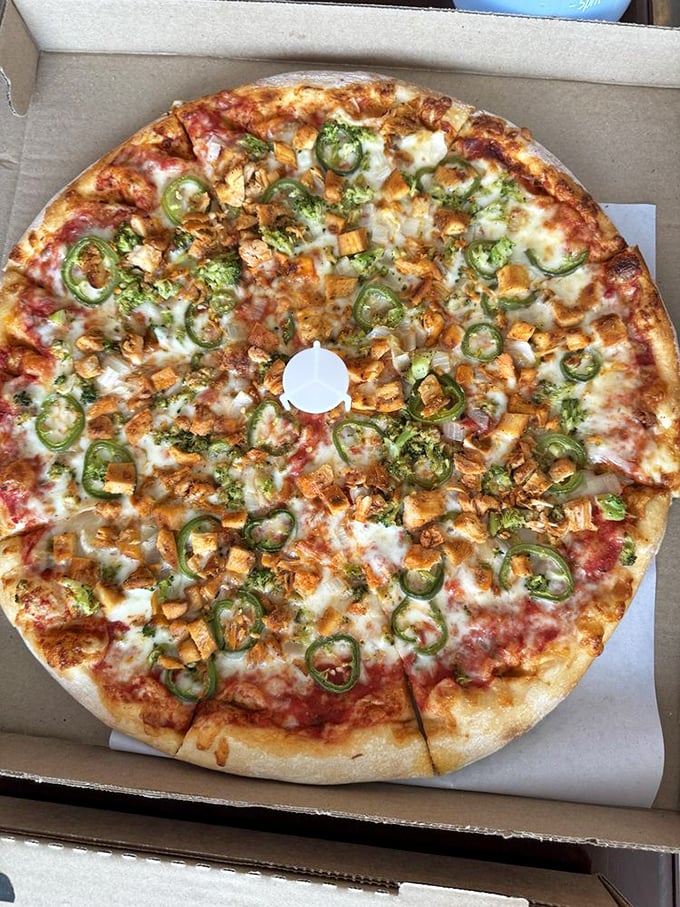 This chicken and jalapeño masterpiece proves San Lucas doesn't just make great pizza—they create edible art with the perfect kick of heat.