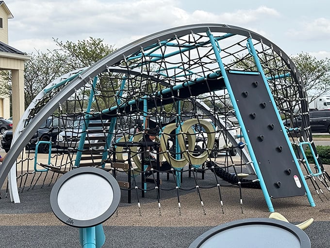 Between shopping sprees, little adventurers scale this modern playground while parents debate the merits of one more store visit.