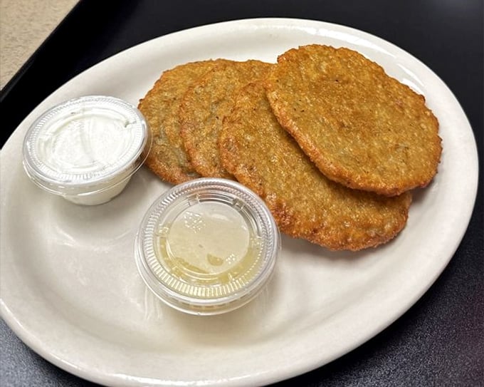 Potato pancakes that your grandmother would approve of—crispy edges, tender centers, and absolutely zero pretension. The sour cream is non-negotiable. 
