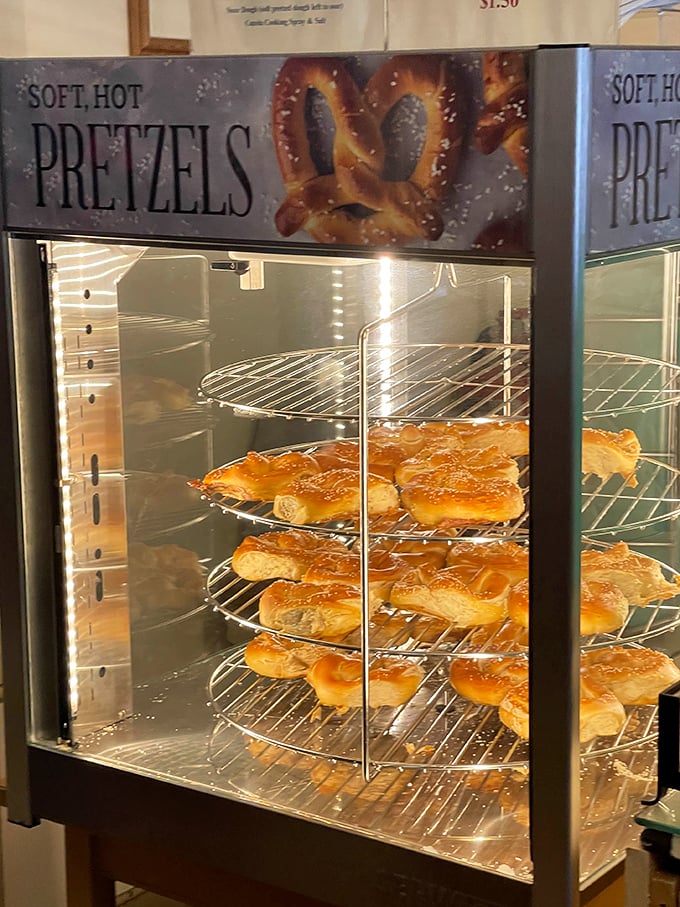 The warm glow of the pretzel display case—a beacon of hope for the hungry and a showcase of perfectly twisted, golden-brown craftsmanship.