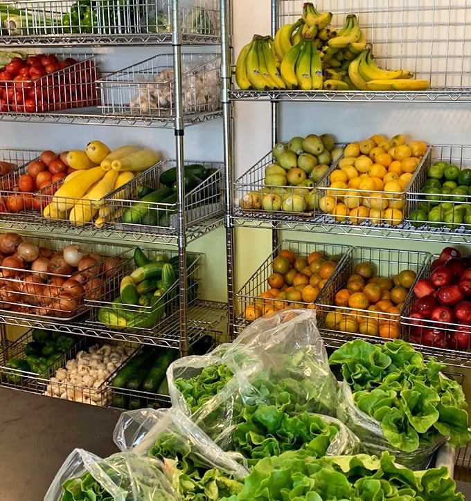 Not just a thrift store—a food pantry too! Fresh produce arranged with supermarket precision shows Poverello's commitment to nourishing the community in multiple ways.