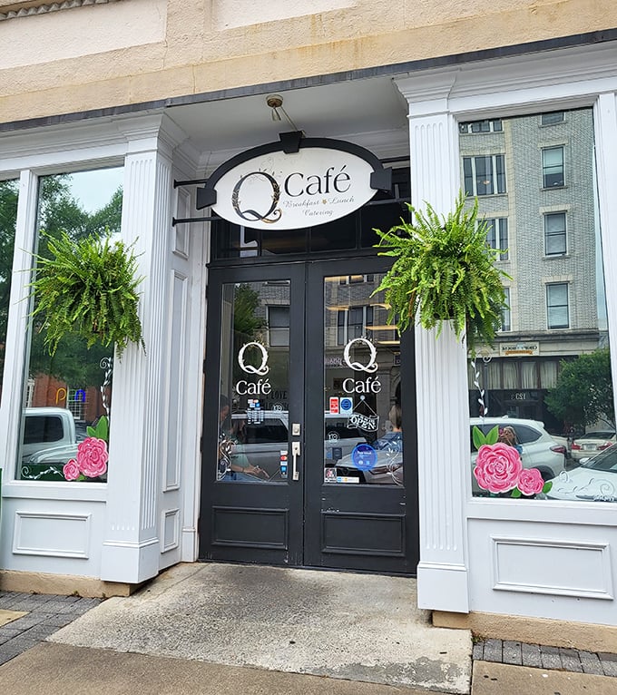 Q Café's inviting entrance, flanked by lush ferns, promises the kind of breakfast that makes morning people out of night owls.