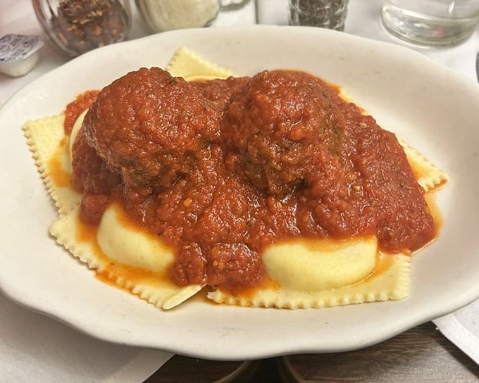 Ravioli and meatballs—the dynamic duo of comfort food. Those pillows of pasta look ready to float away if not anchored by that hearty sauce.