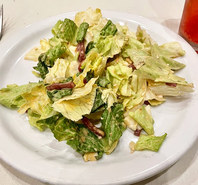 A house salad that doesn't apologize for being simple. In the land of meat, this crisp ensemble provides the perfect palate cleanser.