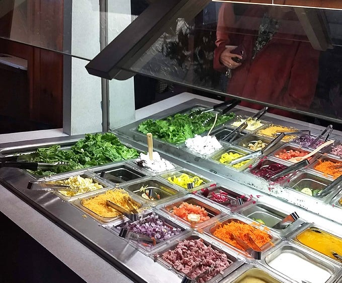 A salad bar that's a feast for the eyes—fresh ingredients lined up like soldiers ready to complement those hearty main courses.