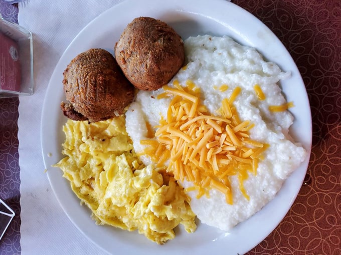 Salmon croquettes with grits and eggs—a Southern breakfast trifecta that proves fish for breakfast isn't just acceptable, it's exceptional.