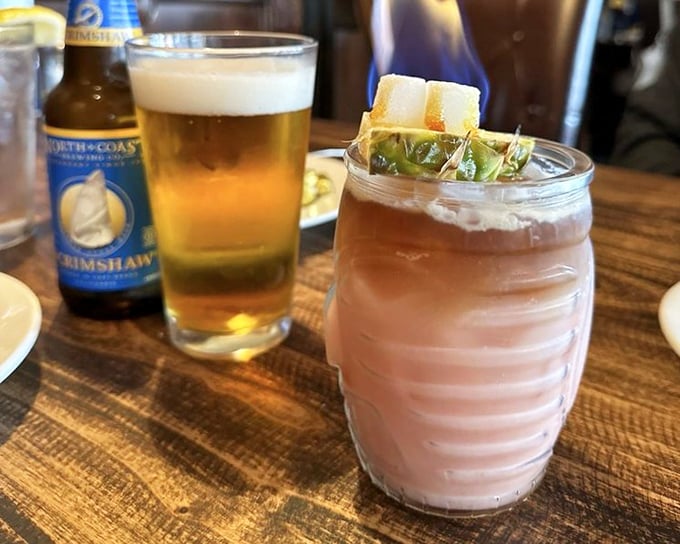 Local craft beer alongside what appears to be a signature cocktail. Because sometimes the perfect seafood companion isn't wine, but something with a little coastal kick.