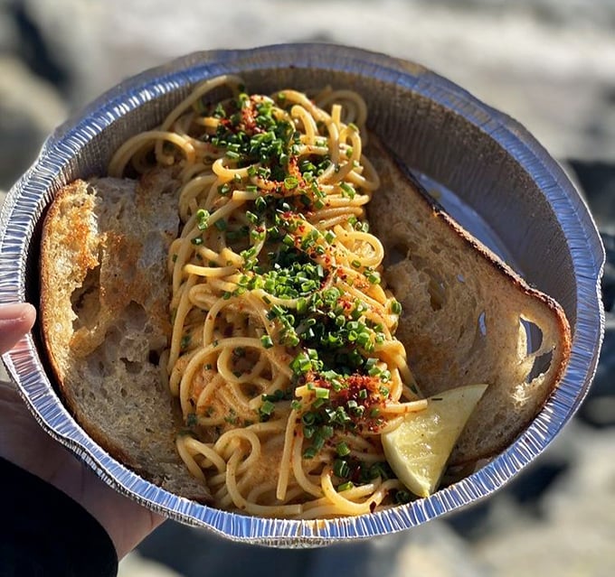 Sea urchin spaghetti served in unpretentious aluminum—a dish that proves luxury ingredients don't need fancy plateware when the flavors are this symphonic and satisfying.