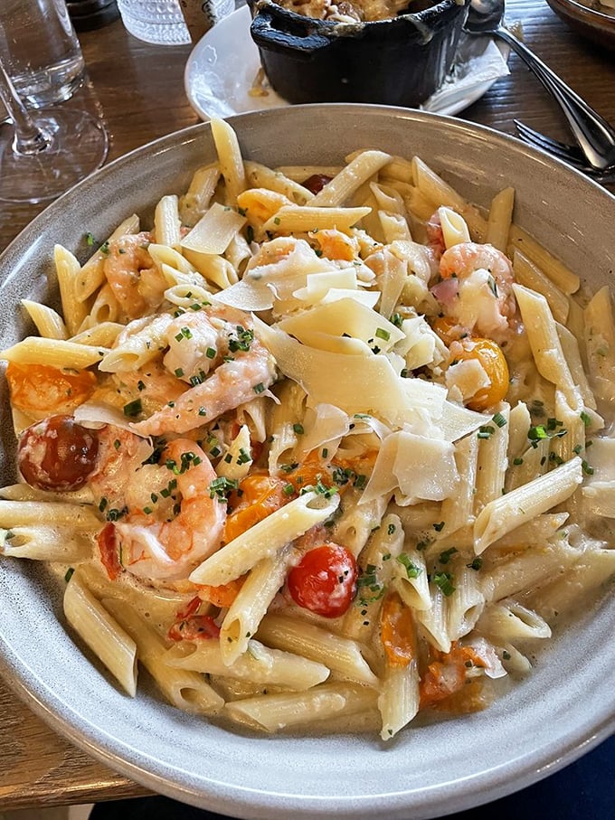 Pasta that doesn't just sit on the plate – it performs. Those shrimp look like they're doing a delicious synchronized swimming routine.