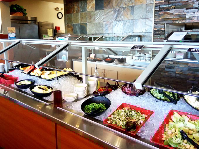 The salad bar offers fresh redemption for those who need to balance their buffet karma before returning to the dessert station.