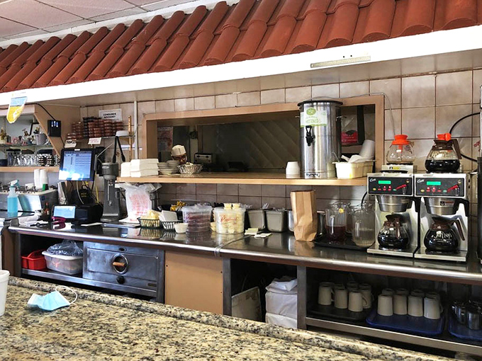 Where the magic happens—counter seats offering front-row views to the choreographed chaos of short-order cooking excellence.