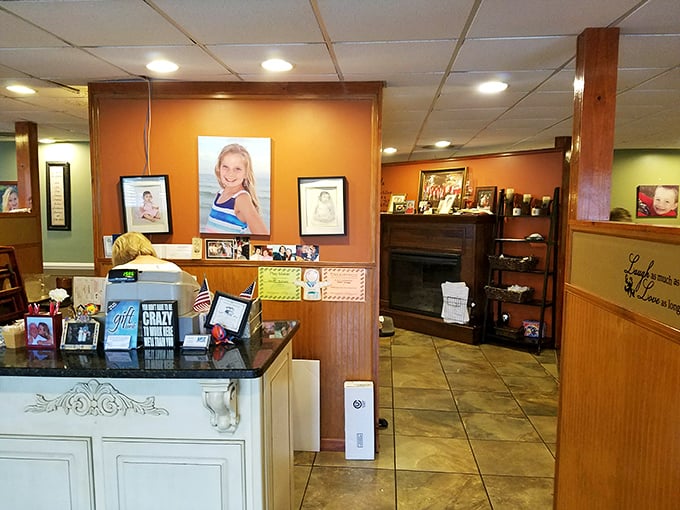 Family photos adorn warm-toned walls, reminding you that the best restaurants aren't just businesses – they're extensions of someone's heart and home.