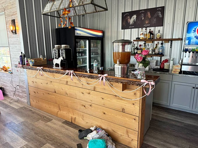 A bar counter adorned with delicate string lights and fresh flowers – where farm-to-glass beverages complement the farm-to-table philosophy.