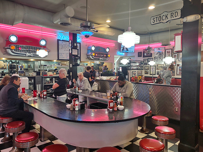 Where chrome meets comfort. The curved counter invites solo diners to feel part of something bigger—a community built on good food.