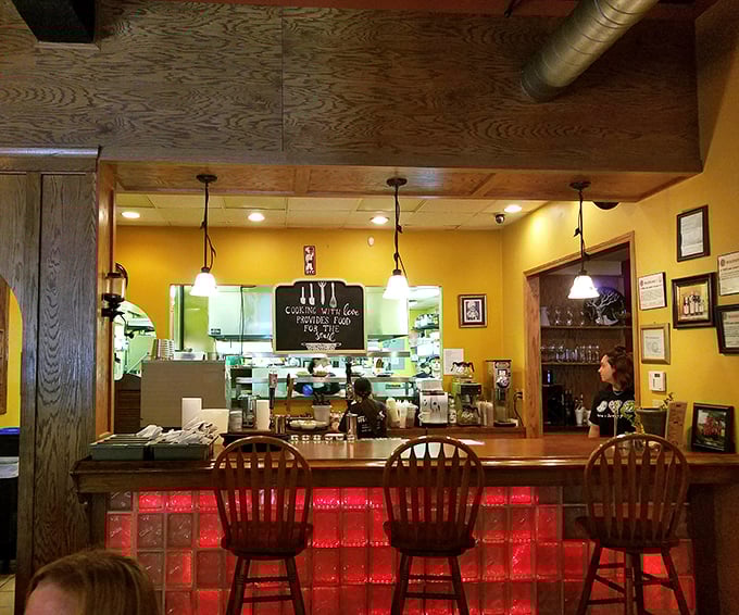 The open kitchen concept lets you witness culinary choreography in action—where "cooking with love provides food for the soul" isn't just a wall sign.