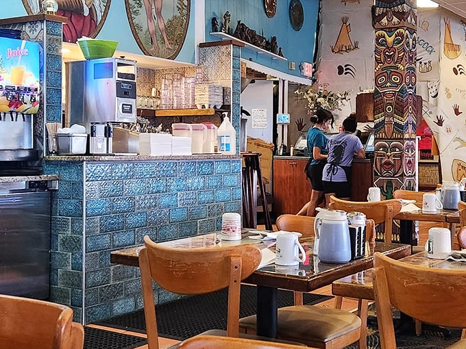 Blue tiles and wooden accents create the perfect backdrop for morning rituals—where servers transform coffee and conversation into the start of a perfect day.