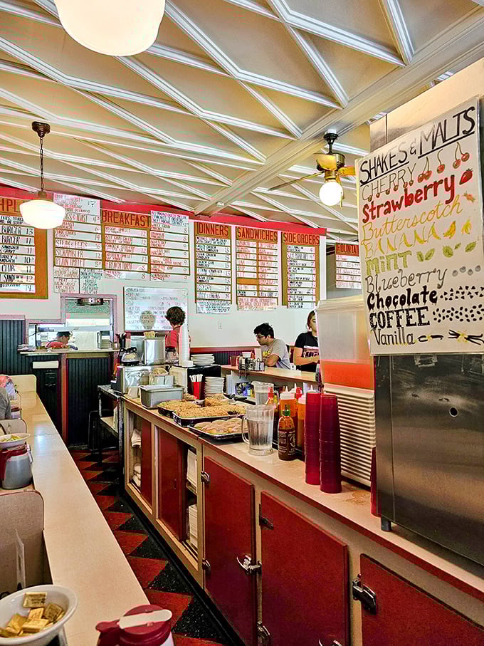 The shake flavor board reads like a dessert rainbow, proving that at Mickies, milkshakes aren't just drinks—they're liquid happiness.