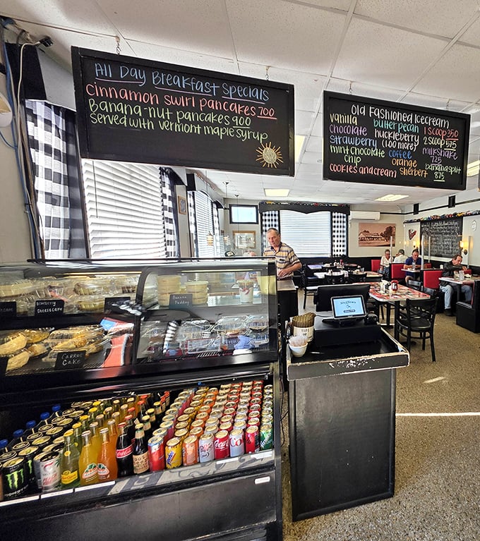 Handwritten specials on chalkboards announce cinnamon swirl pancakes and banana nut pancakes – proof that innovation still happens in traditional kitchens.