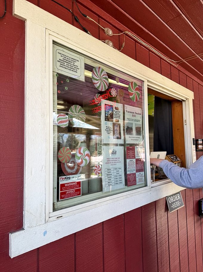 The ordering window – where dreams come true and decisions get difficult, as friendly faces await to translate your hunger into barbecue reality.