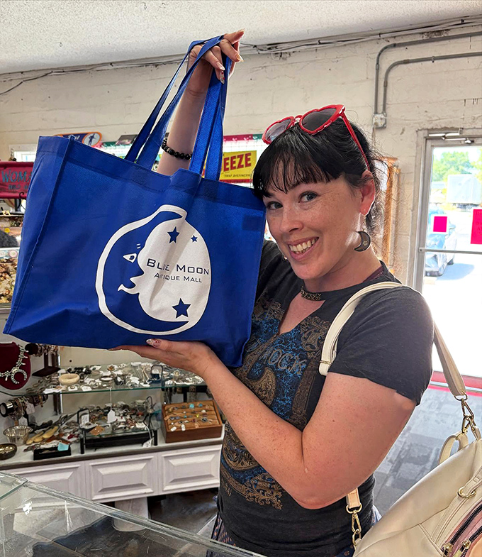Shopping victory captured in a single blue tote bag. The thrill of the find is universal—and apparently comes with its own branded merchandise.