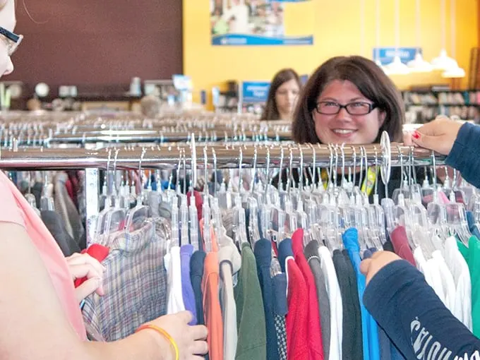 Shoppers navigate the clothing racks with the focus of archaeologists on a dig. The thrill of the hunt is universal, regardless of what's in your wallet.