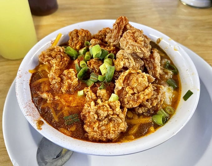 Fried shrimp lounging in a spicy broth like they're at a spa. This isn't just food—it's edible art with a Southern accent.
