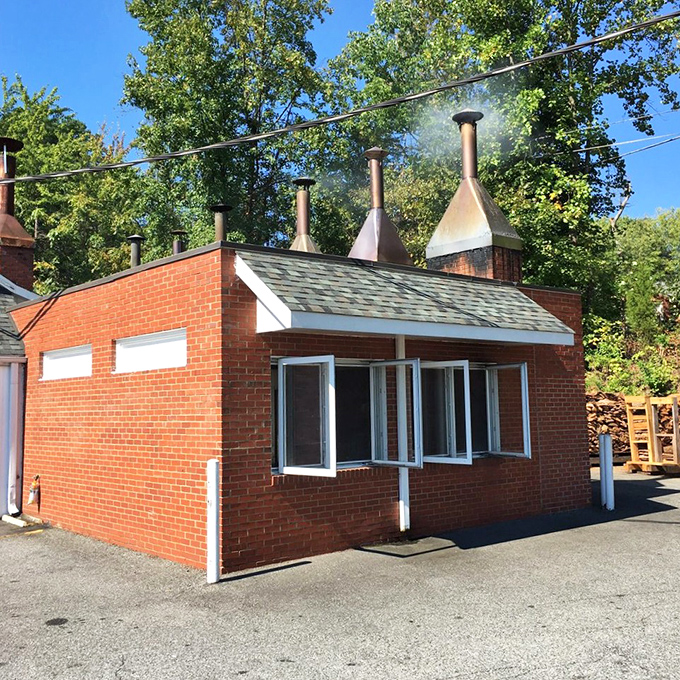 The smokehouse—where the real magic happens. Those chimneys are basically barbecue lighthouses, guiding hungry souls to pork perfection.