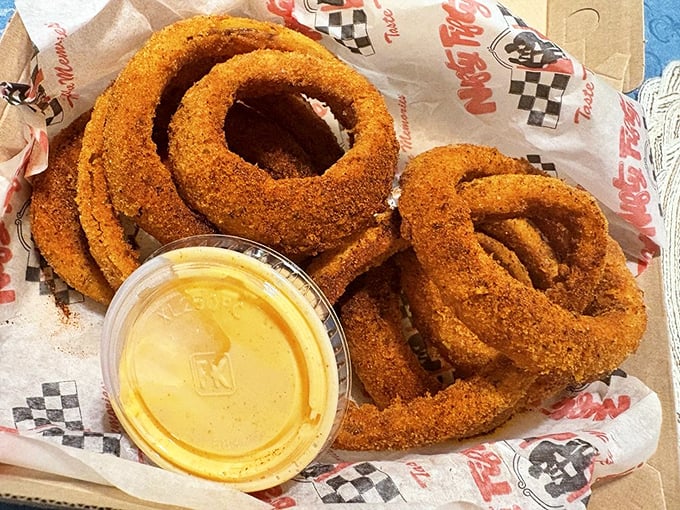 These aren't just onion rings—they're crispy, golden halos of happiness that make you wonder why vegetables ever bothered being healthy.