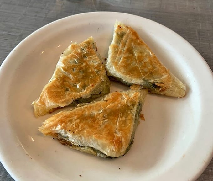 Spinach pie that would make Popeye weep with joy. Flaky, savory perfection that proves vegetables can be indulgent too.