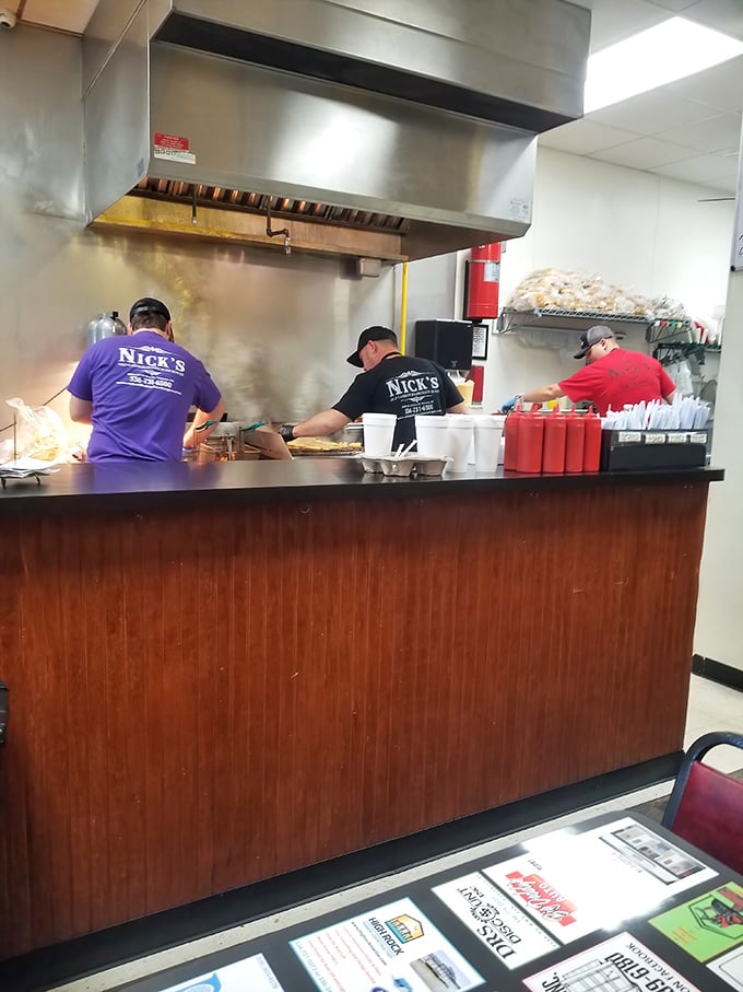 Nick's staff works with the synchronized precision of people who know exactly what they're doing. Those shirts aren't just uniforms—they're badges of honor.